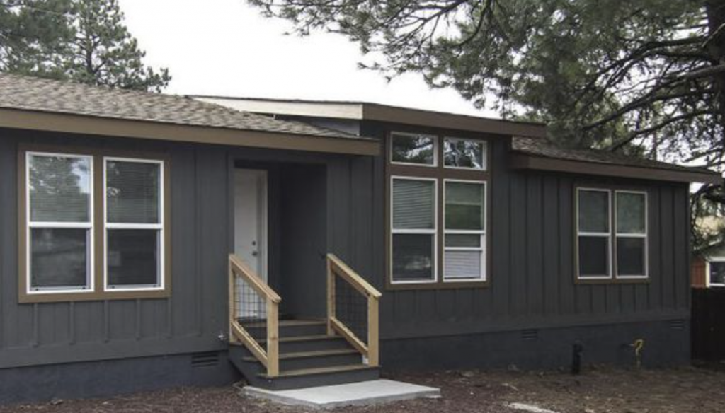 The exterior of this home is painted a slate gray, one of our favorite ...